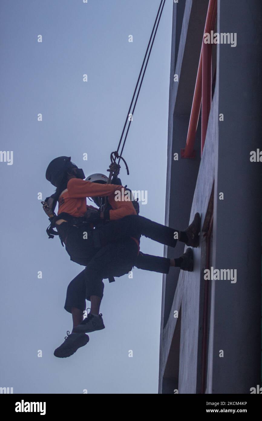 Personel of National Search and Rescue Agency (BASARNAS) rescue the ...