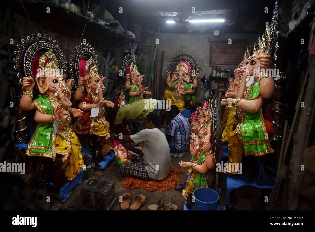 Ganesh idol artists give last minute finishing touch ahead of Ganesh ...