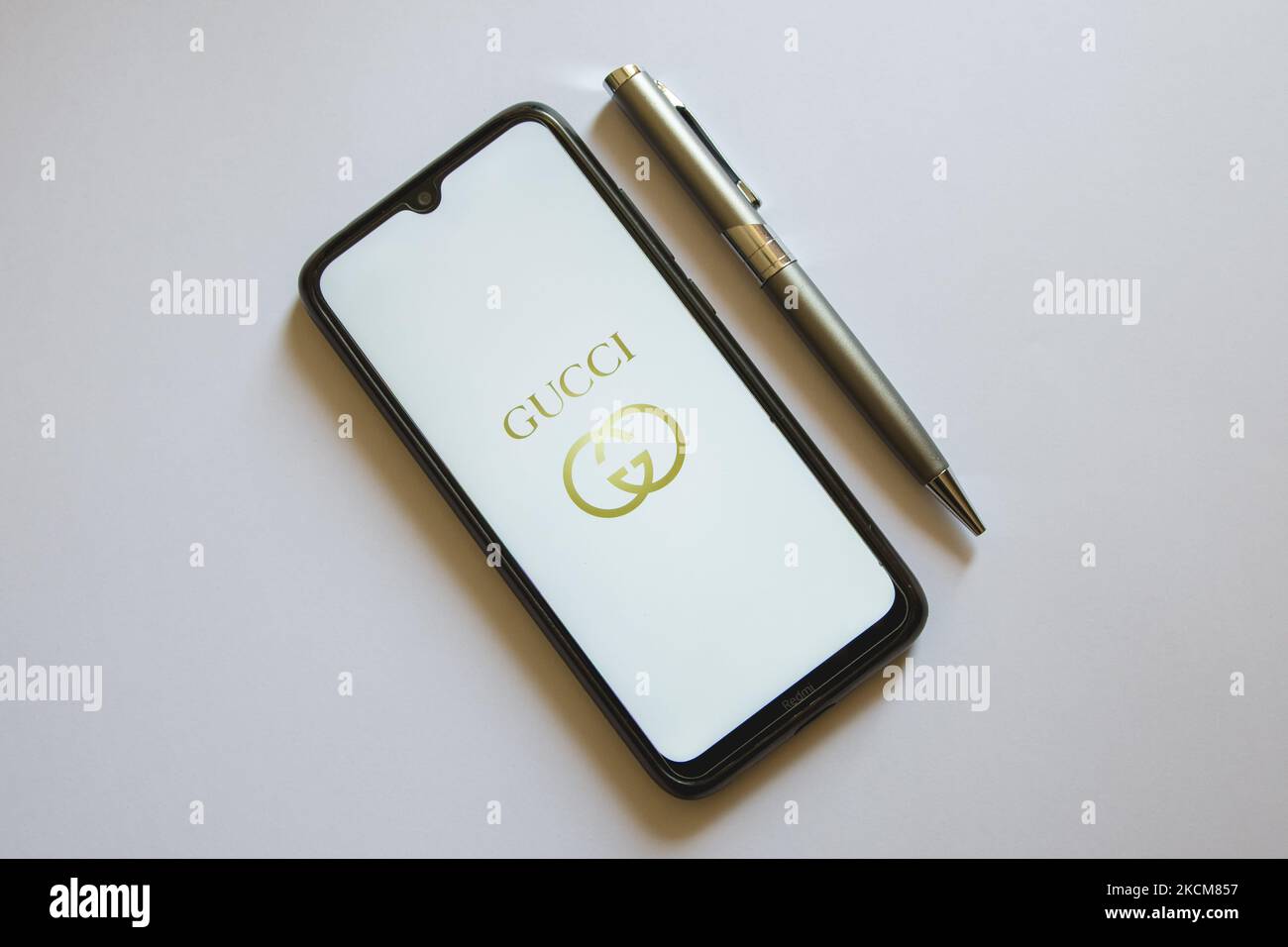 In this photo illustration a Gucci logo is display on a smartphone ...