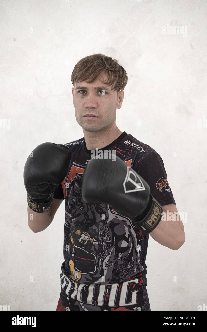 Najib Karimi-25, an Afghan refugee kickboxer, poses for a photograph ...