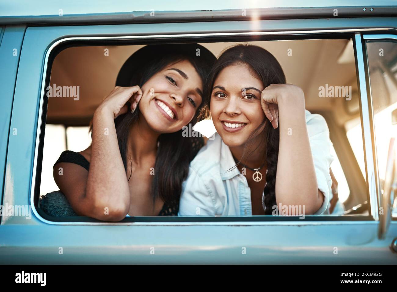 Places to go, fun to be had. two happy young friends going on a road ...