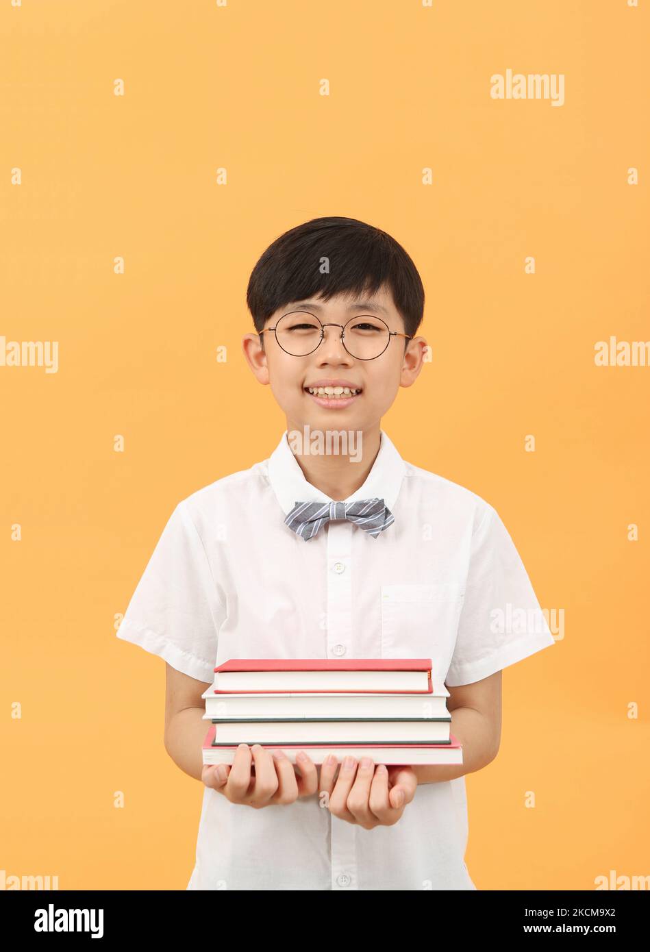 Boy wearing bow tie hi-res stock photography and images - Alamy