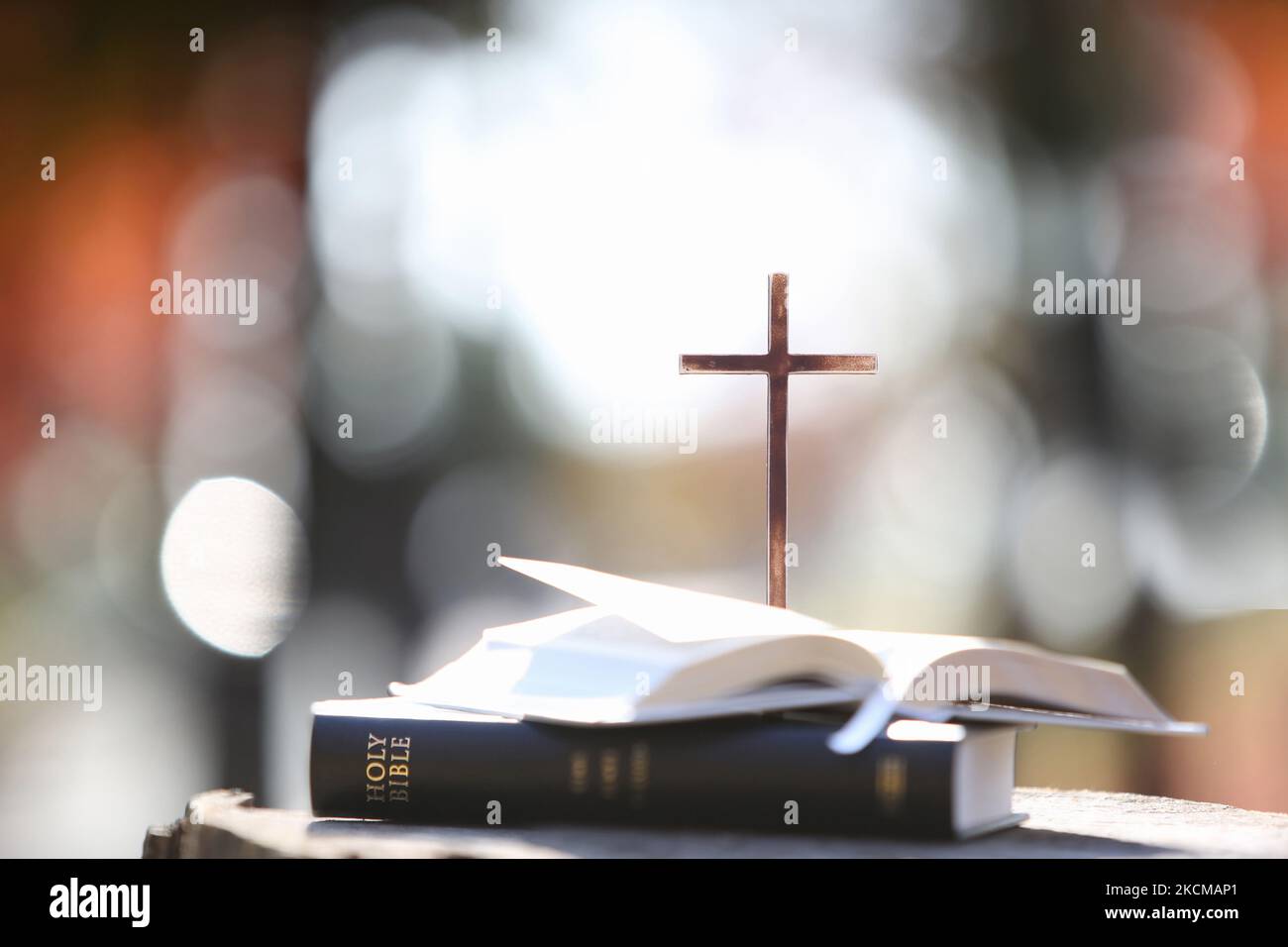 Church bright light background with holy bible and the cross of ...