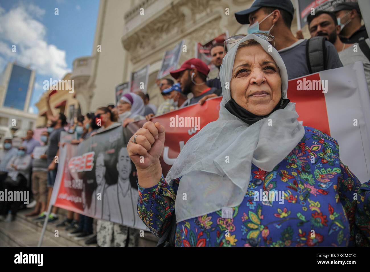 Woman raises fist on hi-res stock photography and images - Alamy