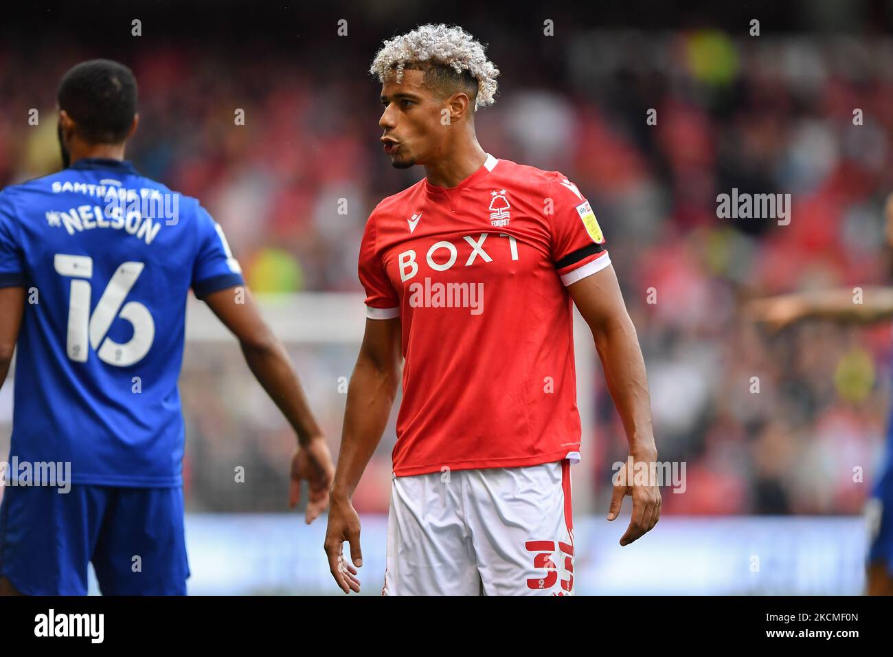 Lyle Taylor of Nottingham Forest has words with the assistant referee ...