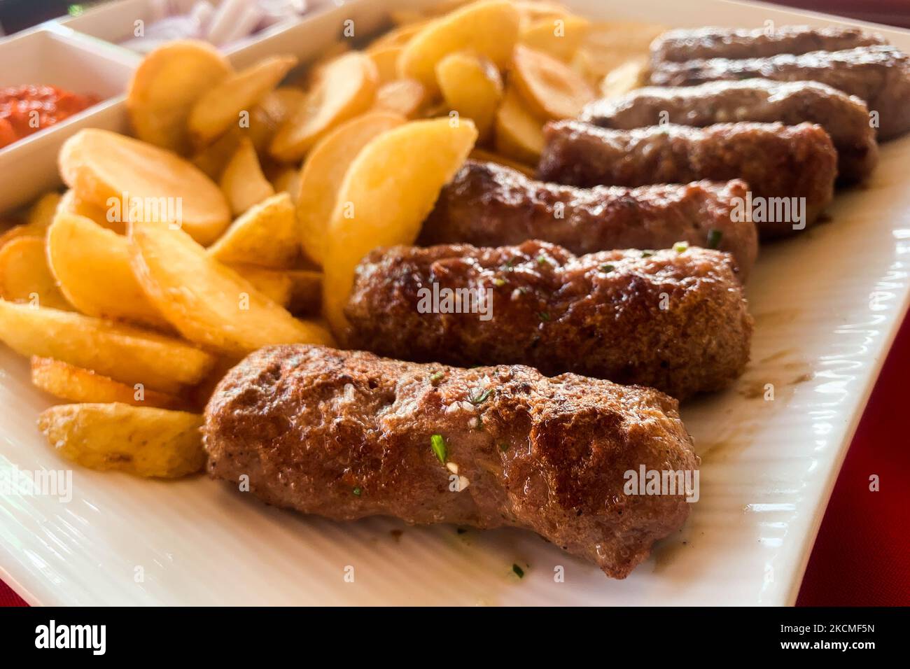 Traditional balkan grilled meat called cevapcici is seen on the ...