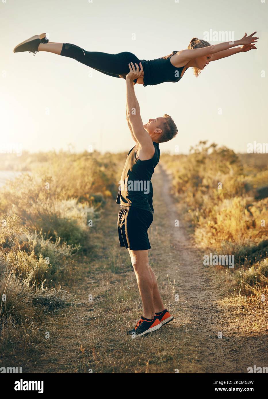 Our love has reached new heights. a young man lifting his girlfriend ...