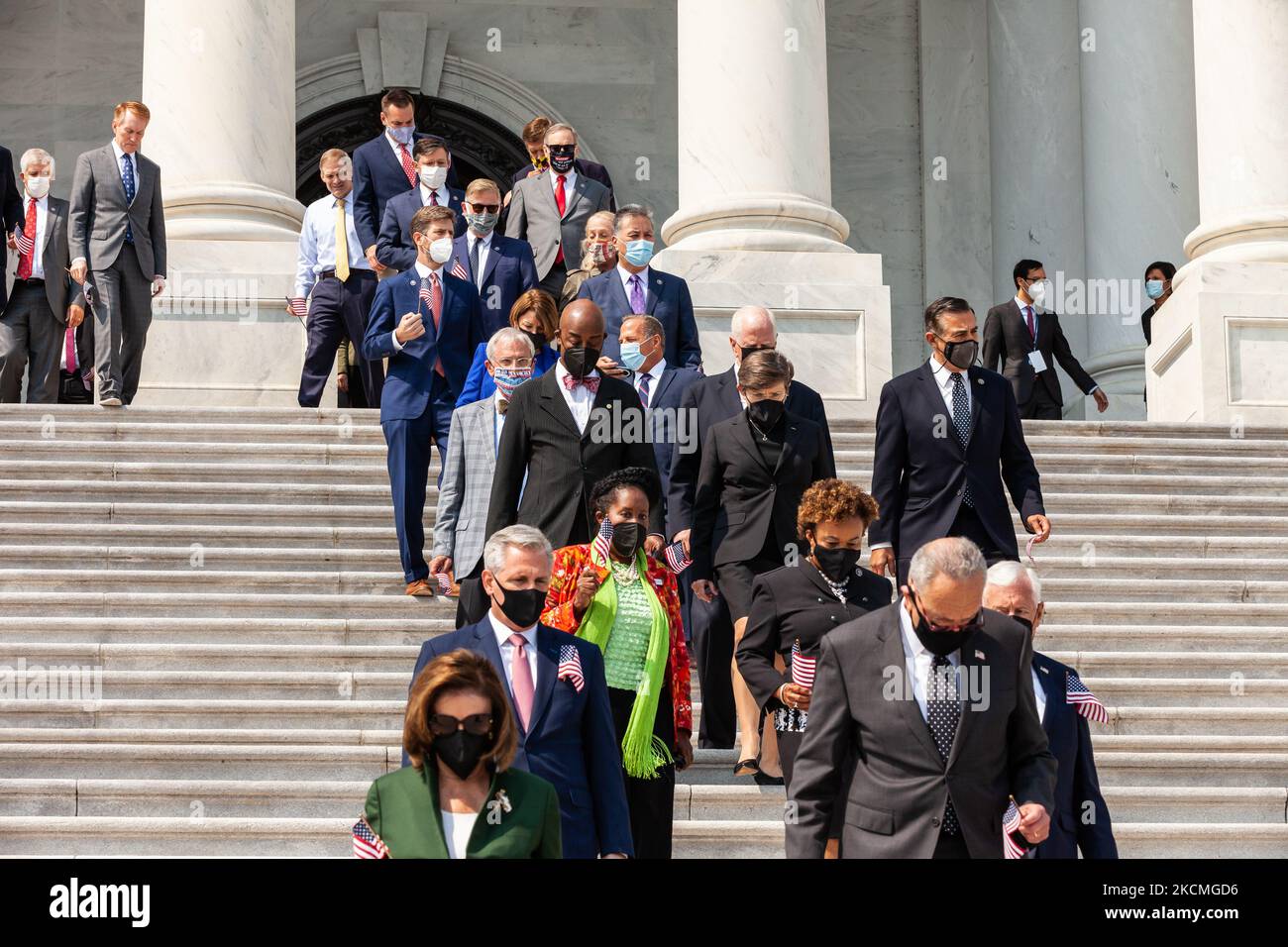Senators and Representatives walk down the center steps for a ceremony ...