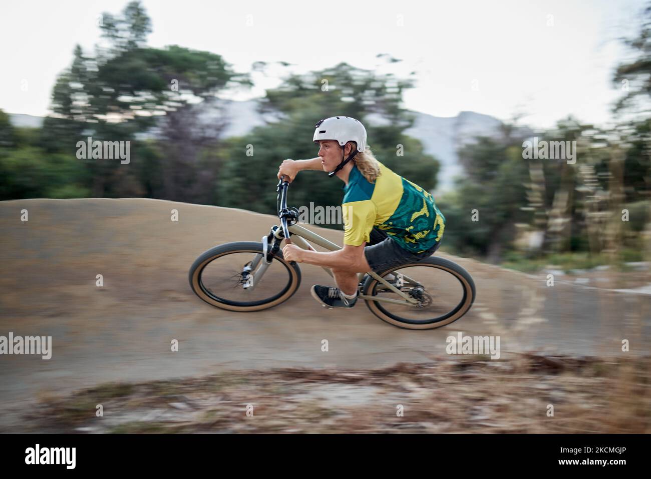 Mountain bike, sports and man with energy, power and action in nature ...