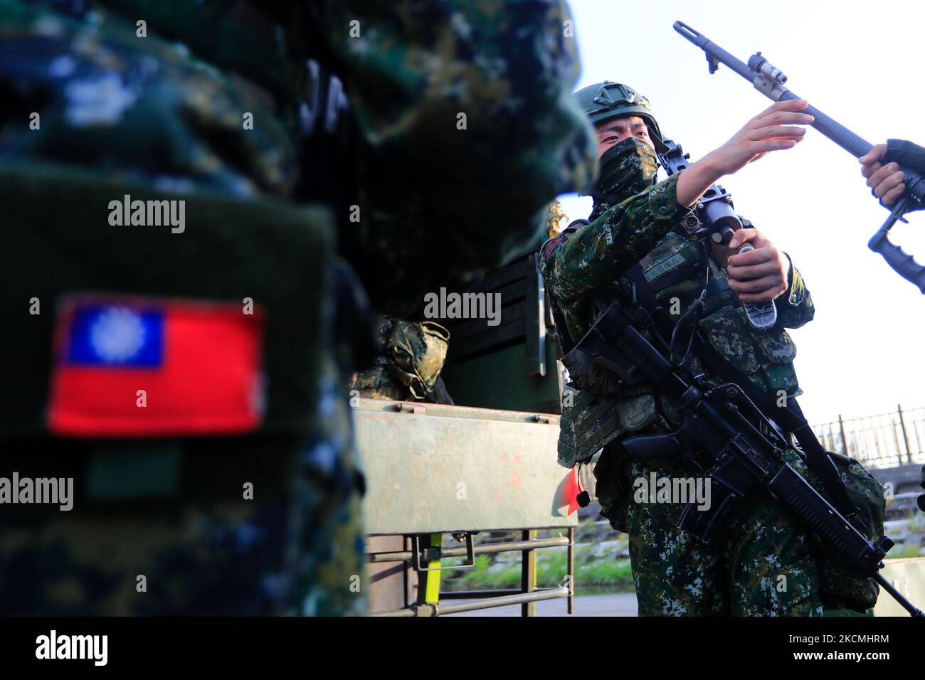 Taiwanese soldiers are seen holding grenade launchers and machine guns ...