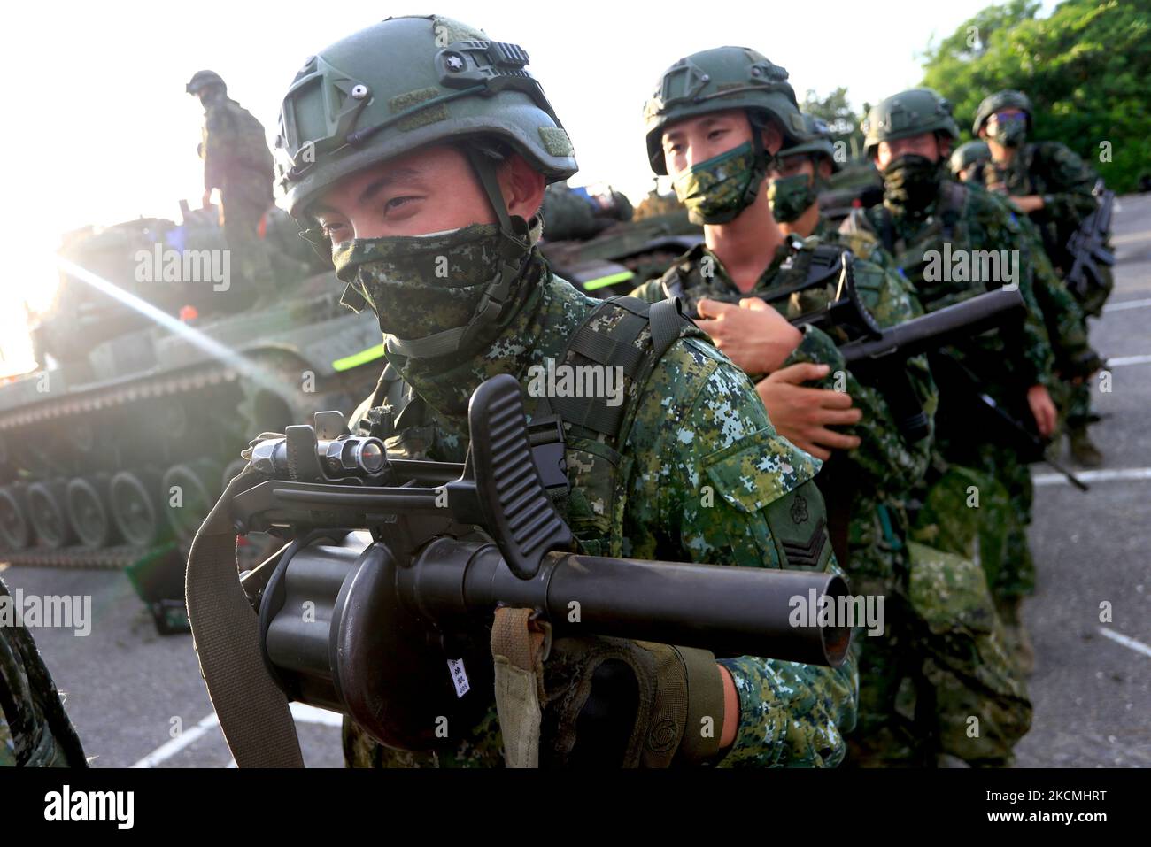 Taiwanese soldiers are seen holding grenade launchers and machine guns ...