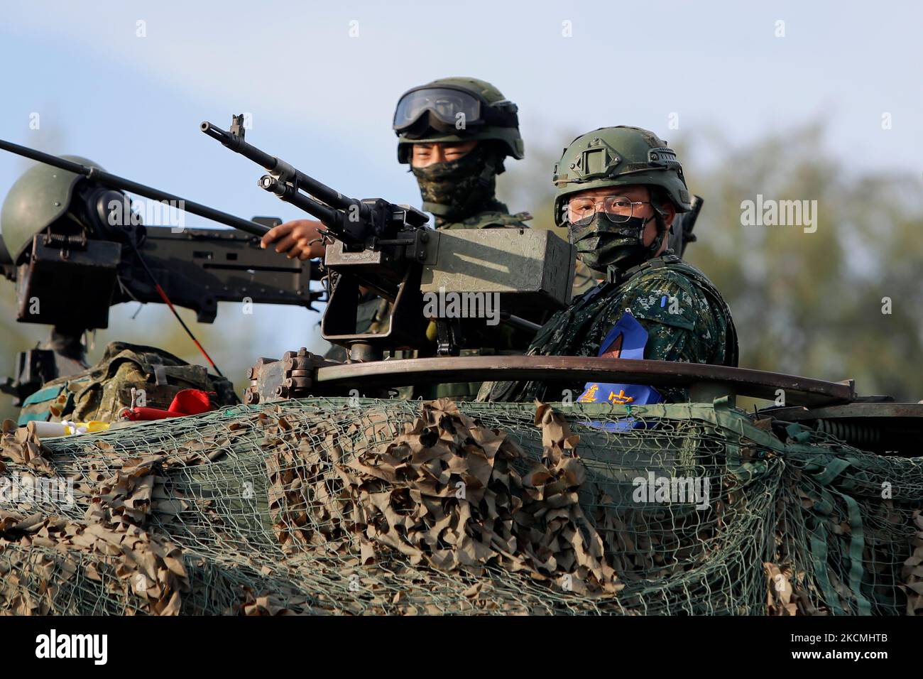 Taiwanese soldiers are seen holding grenade launchers and machine guns ...
