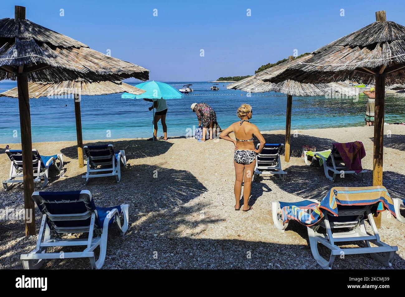 Straw umbrellas are seen on a beach in Primosten, Croatia on September ...