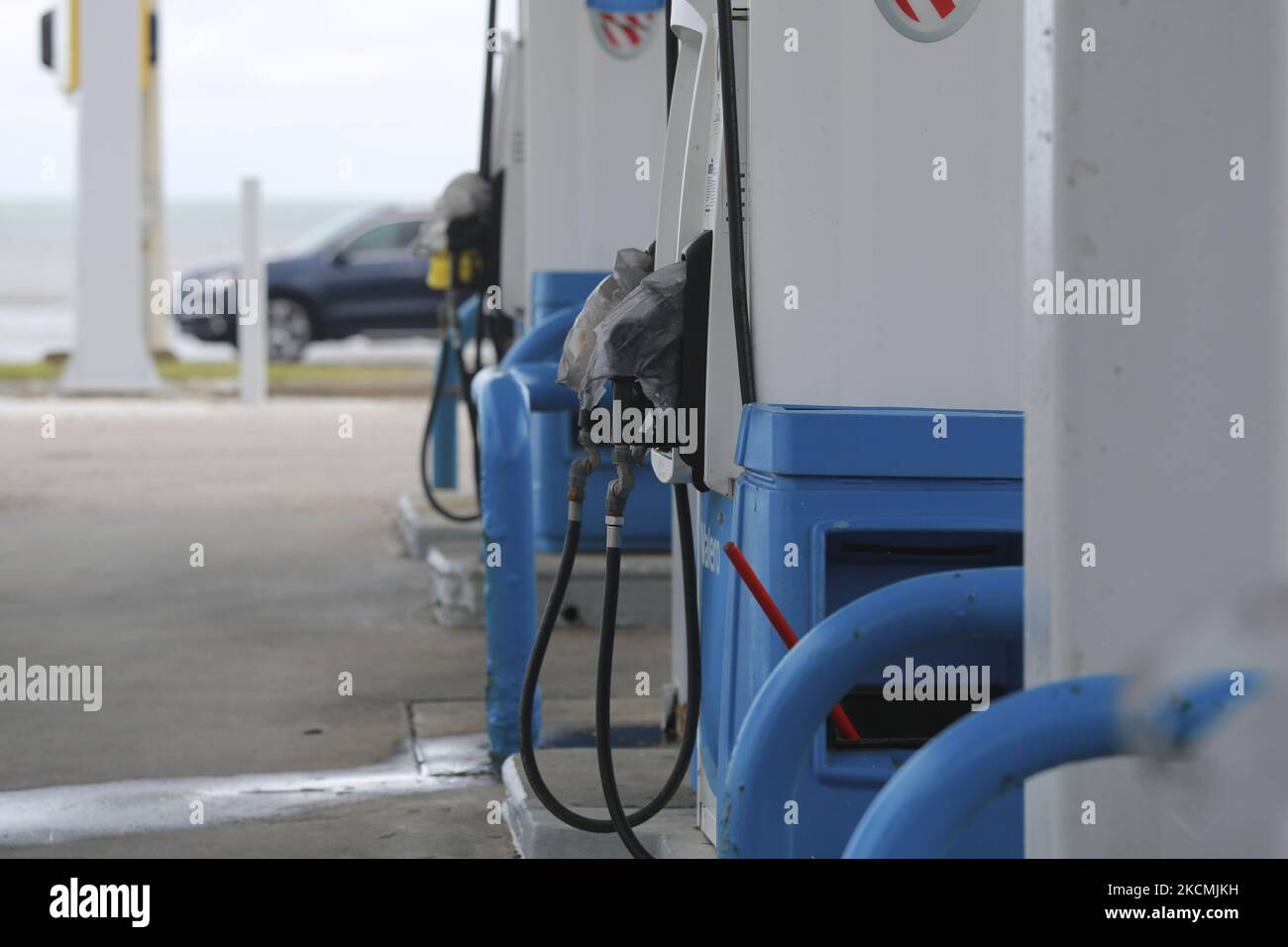 Gas pumps are covered with plastic bags to indicate the pumps have been ...