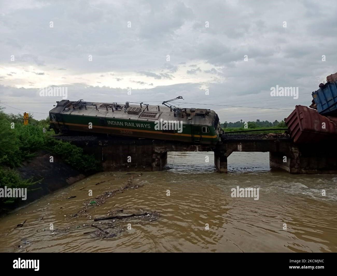 Derailed bogies and engine of a goods train derailed at a bridge as it ...