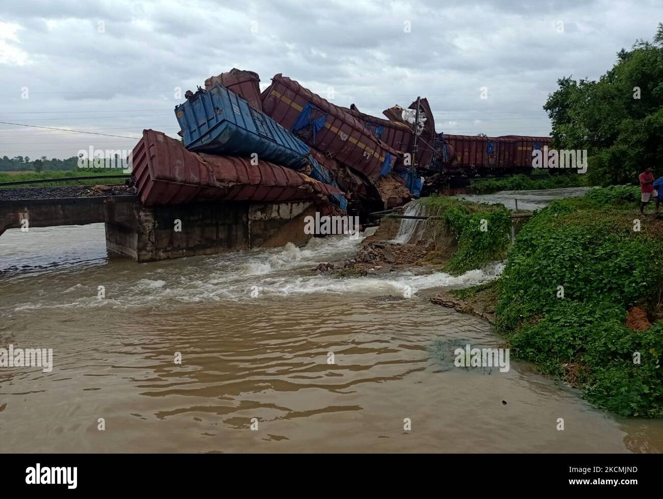 Derailed bogies and engine of a goods train derailed at a bridge as it ...