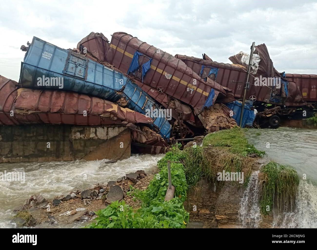 Derailed bogies and engine of a goods train derailed at a bridge as it ...