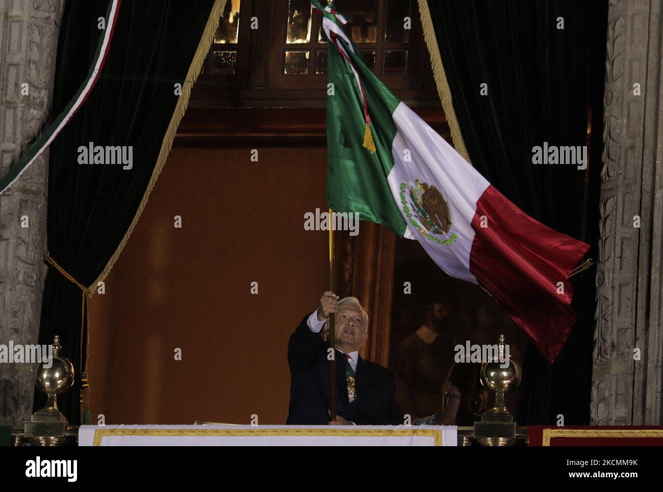 Mexican President Andrés Manuel López Obrador raises the flag from the ...