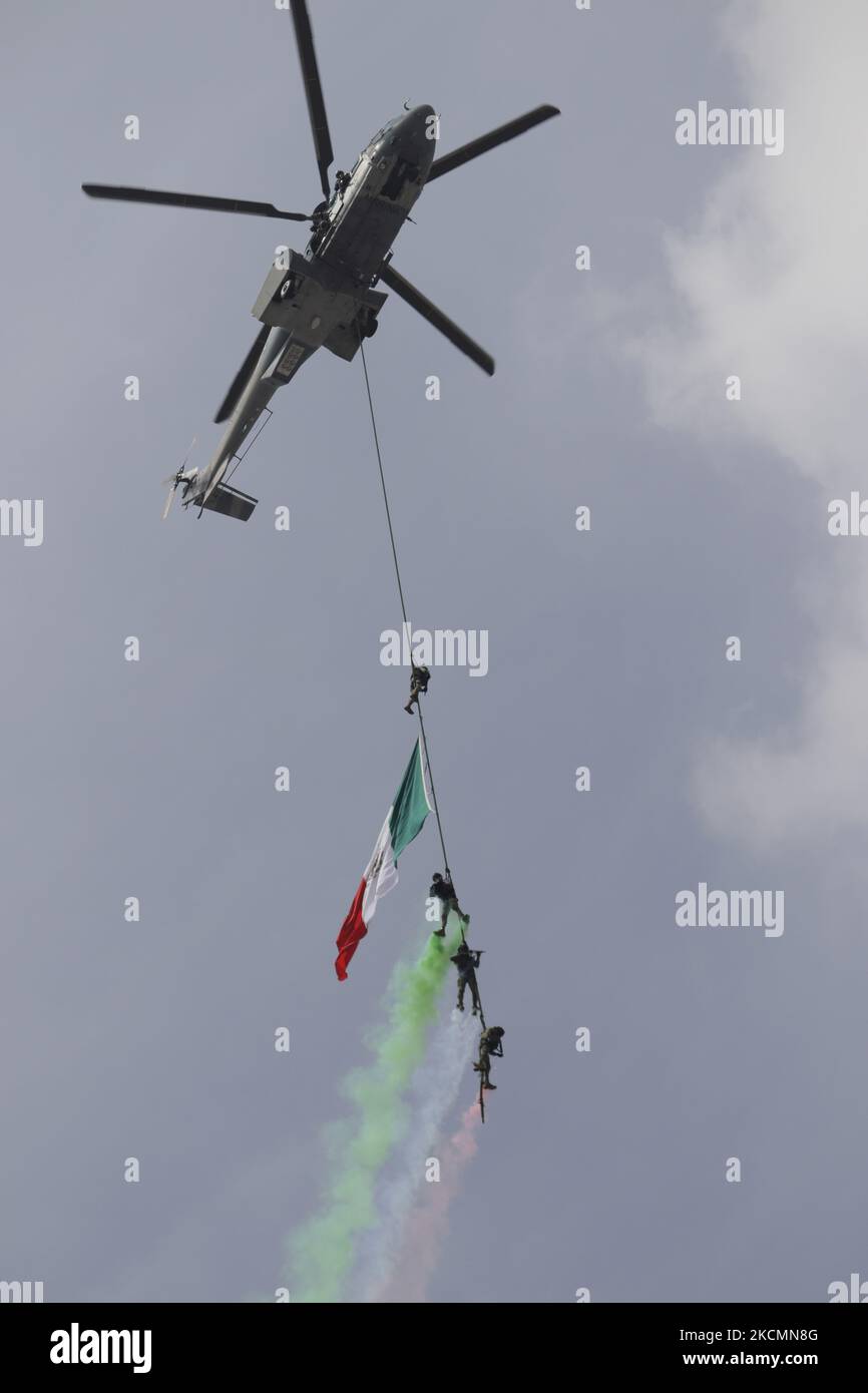A helicopter and members of the Mexican army during an aerial military ...