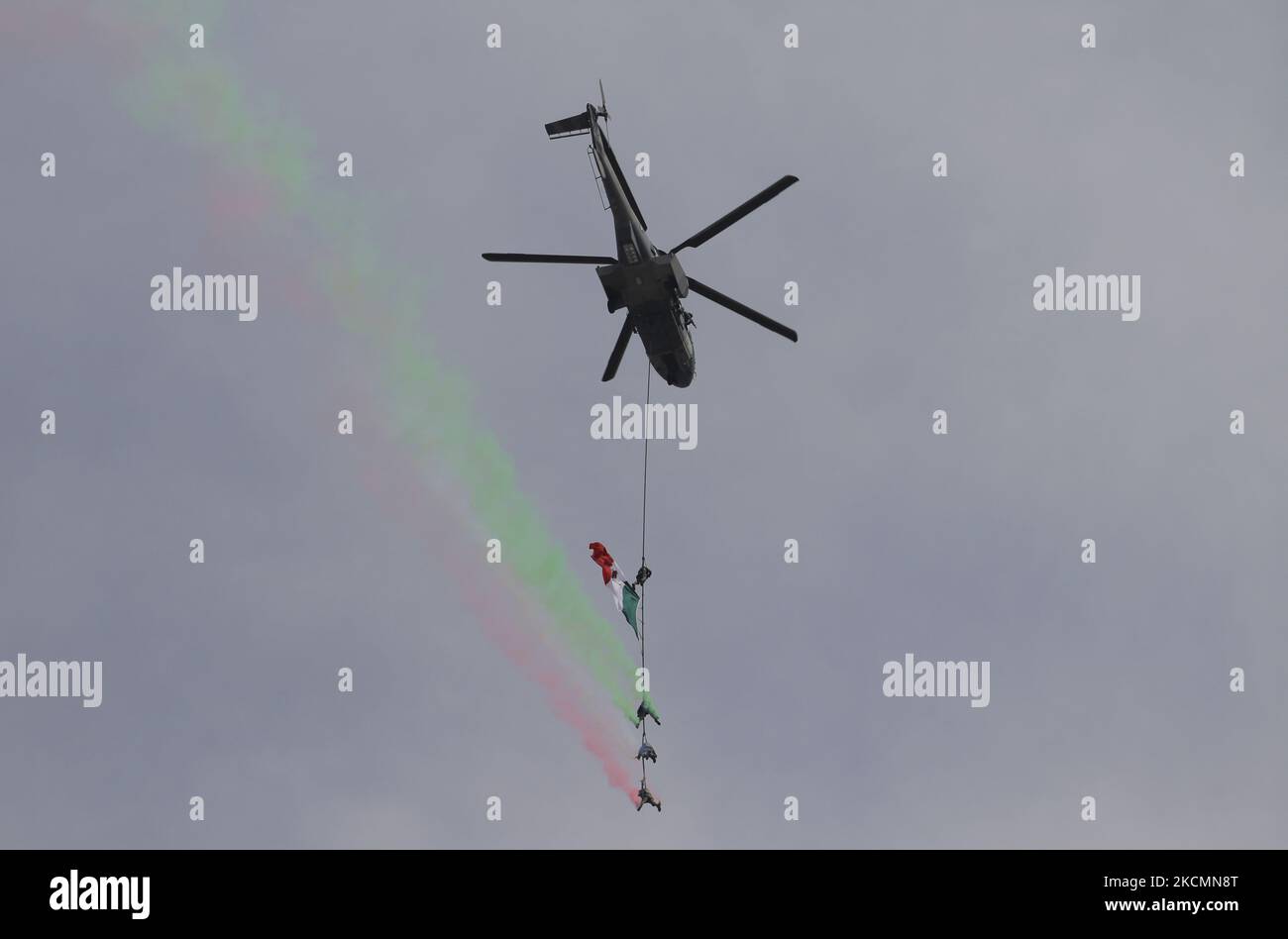 A helicopter and members of the Mexican army during an aerial military ...