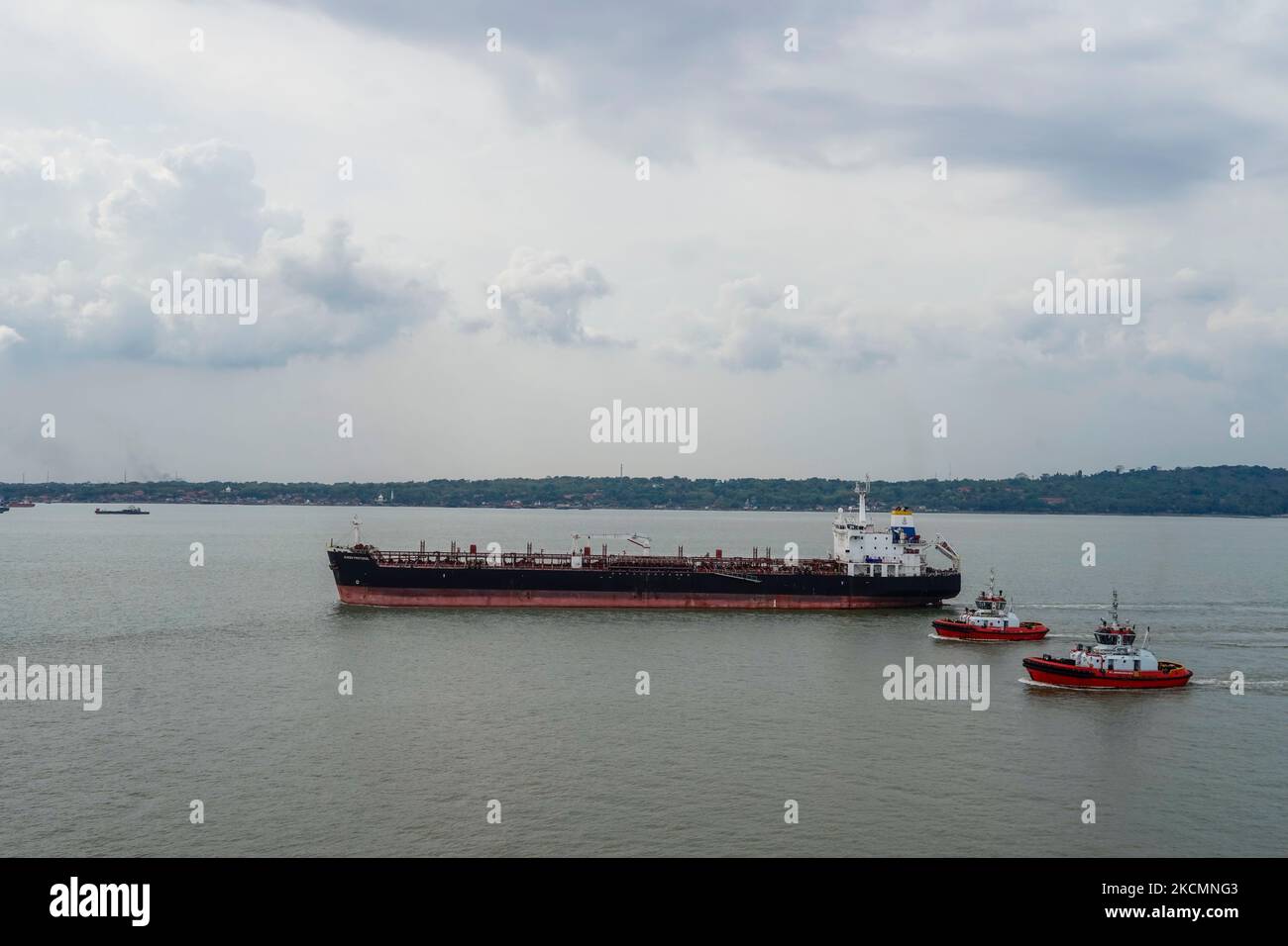 Tugboat and tanker ship maneuver in Tanjung Perak port area, Surabaya ...