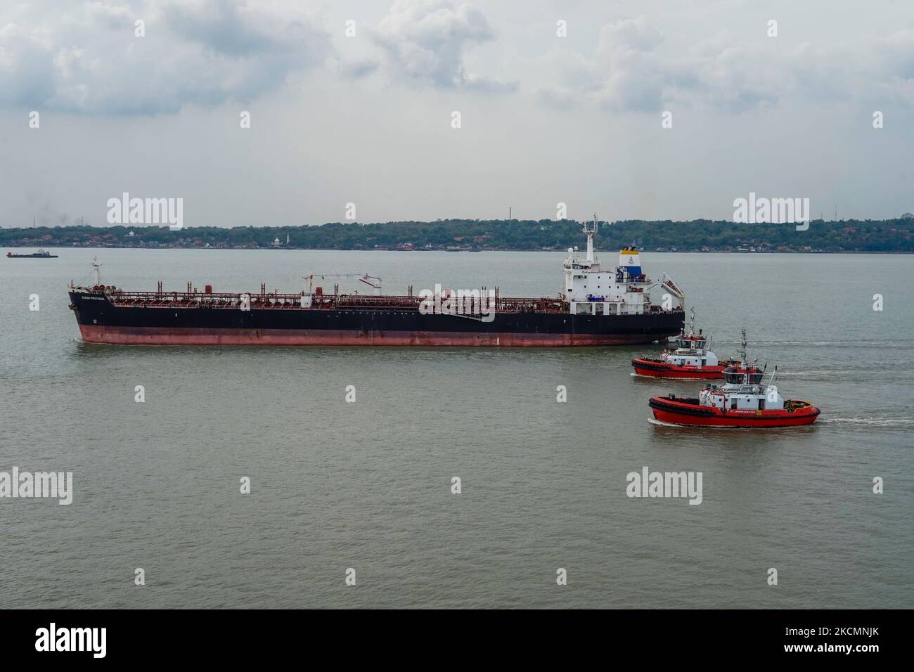 Tugboat and tanker ship maneuver in Tanjung Perak port area, Surabaya ...