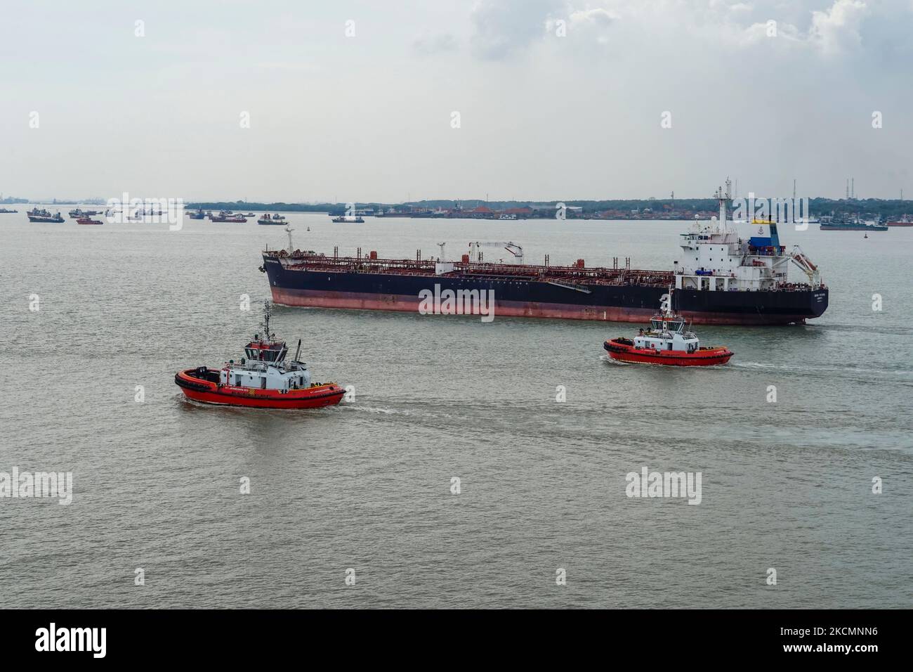Tugboat and tanker ship maneuver in Tanjung Perak port area, Surabaya ...