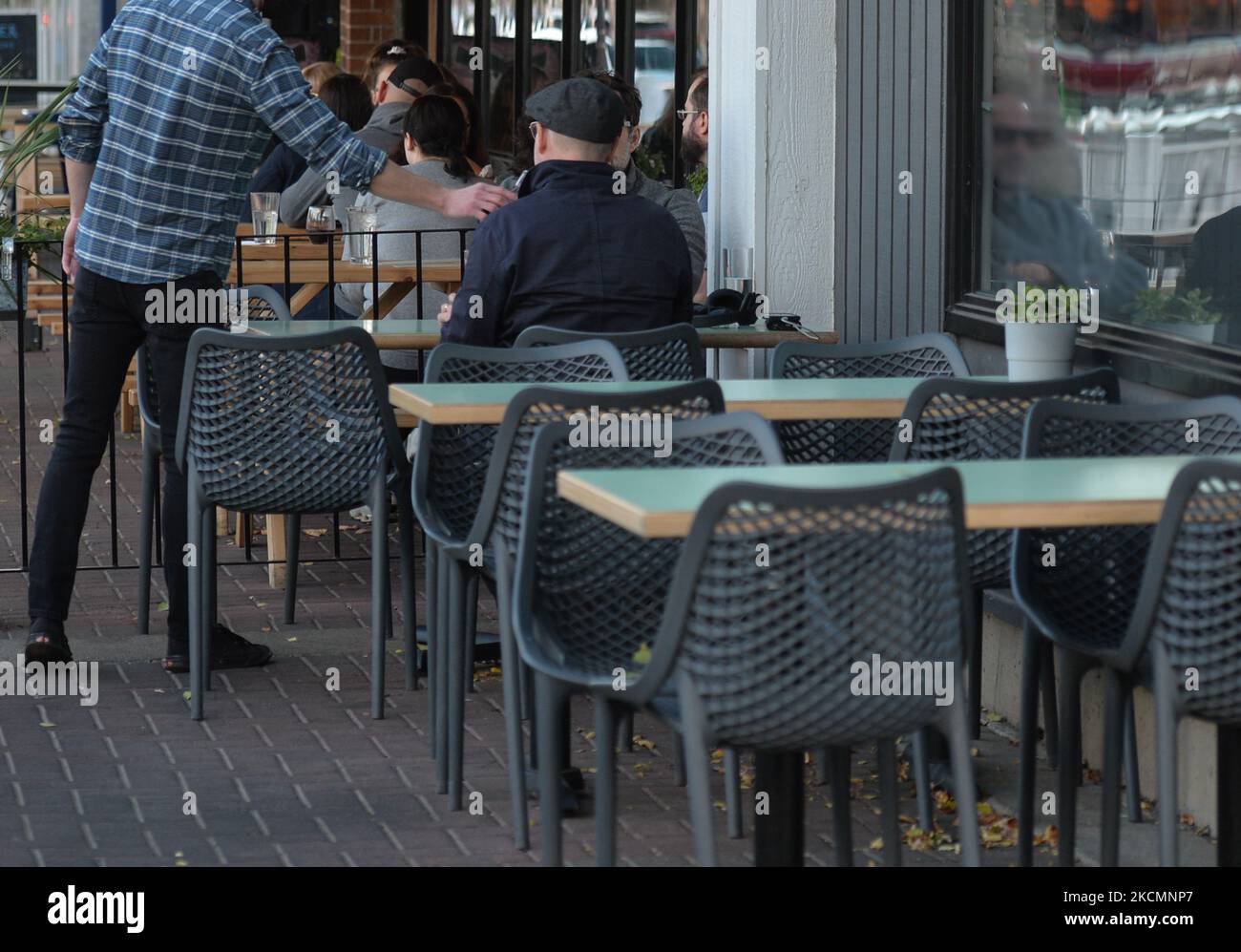 Empty tables in a restaurant in Edmonton center. Alberta has declared a ...