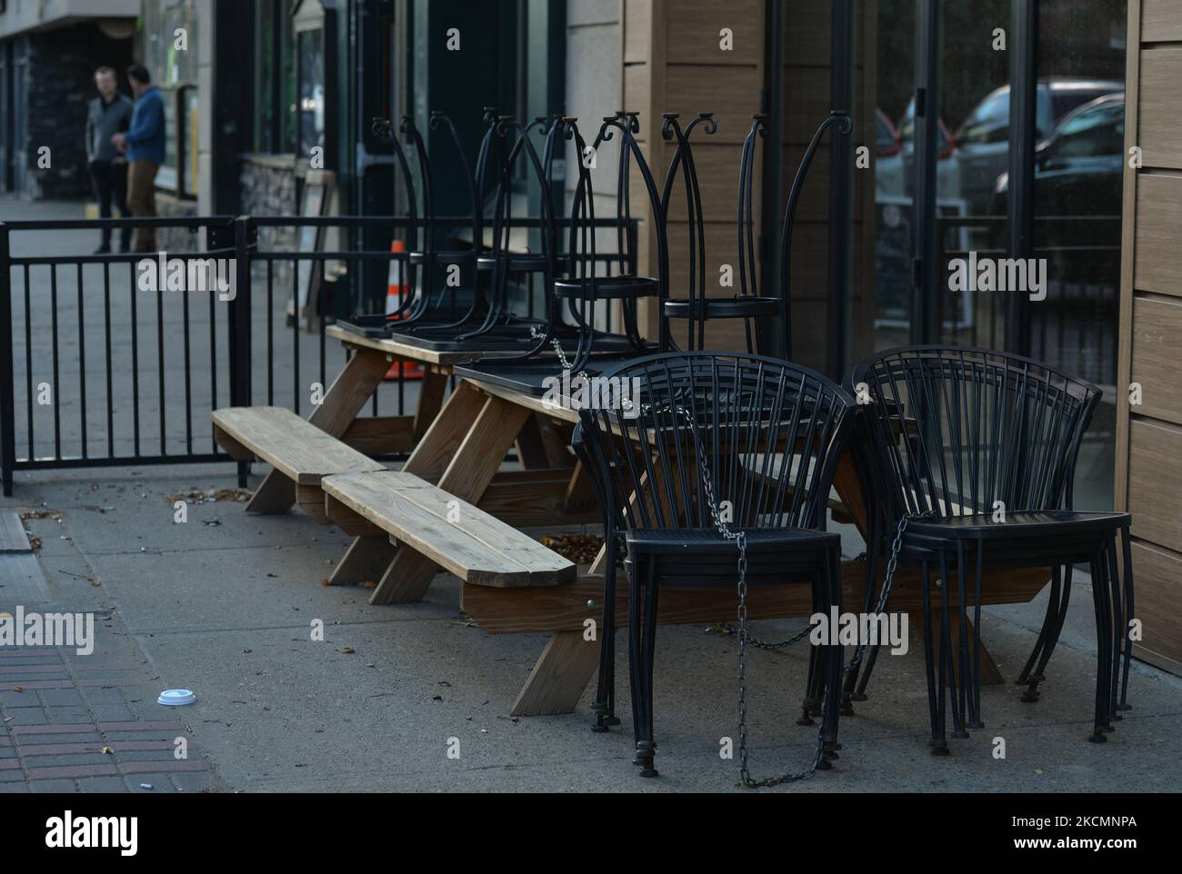 Folded tables and chairs outside a restaurant on Whyte Avenue in ...