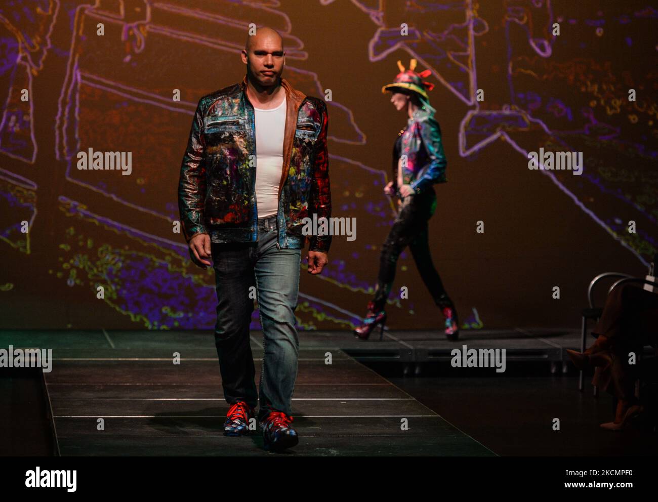 A model shows off an outfit by the Upcycled - Dov Alexander collection ...