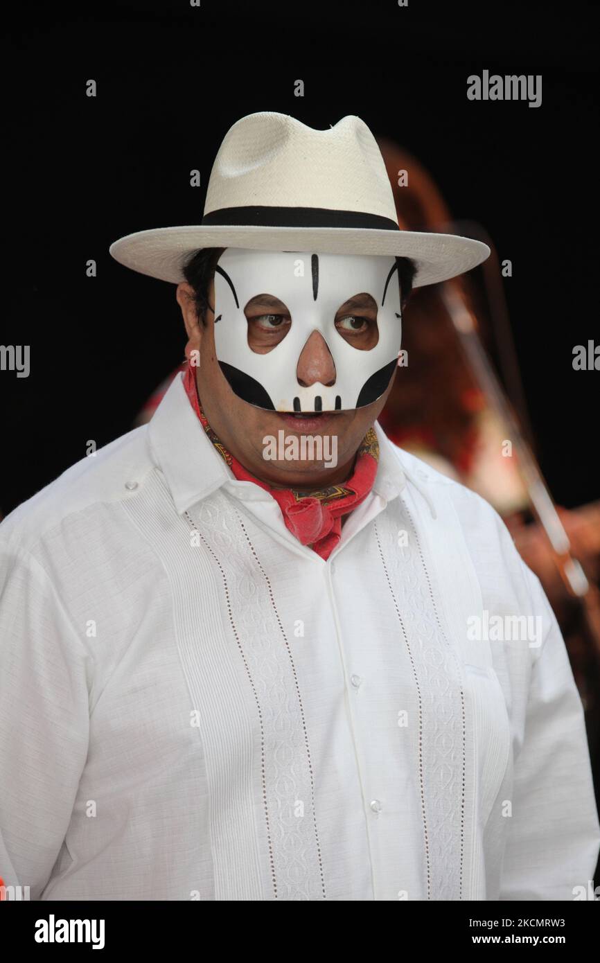 A Masked Mexican dancer performs a traditional dance during the Day of ...