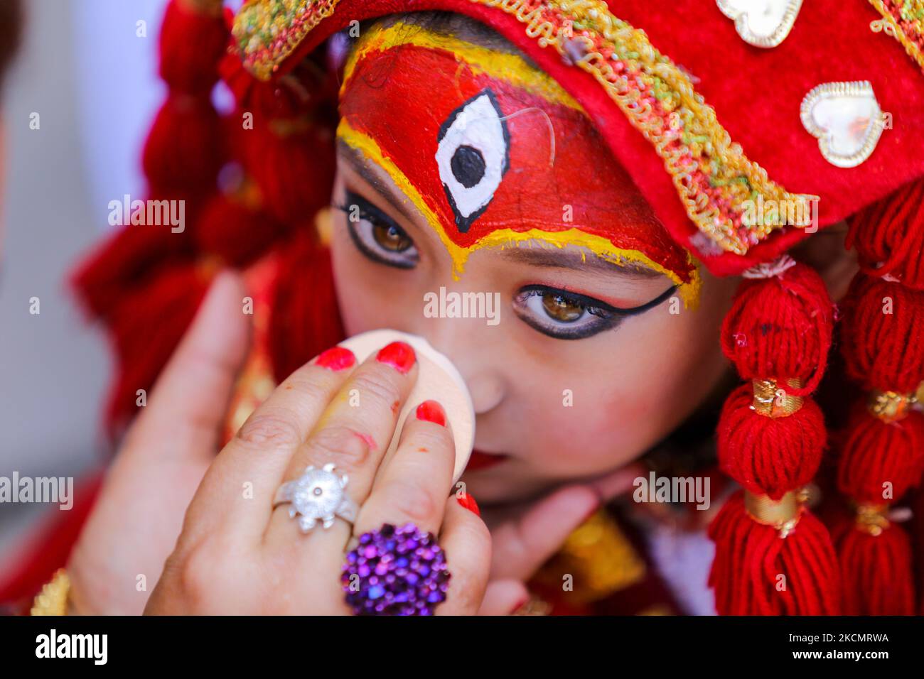 A young girl dressed as the living Goddess Kumari takes part in the ...