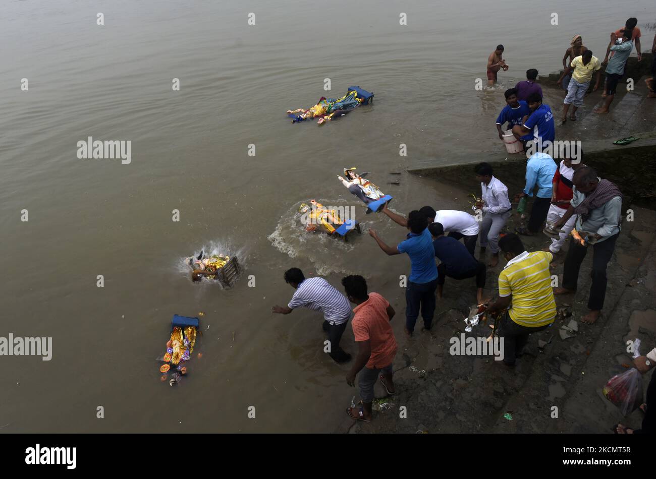 Hindu devotees attend the immersion rituals of Vishwakarma clay made ...