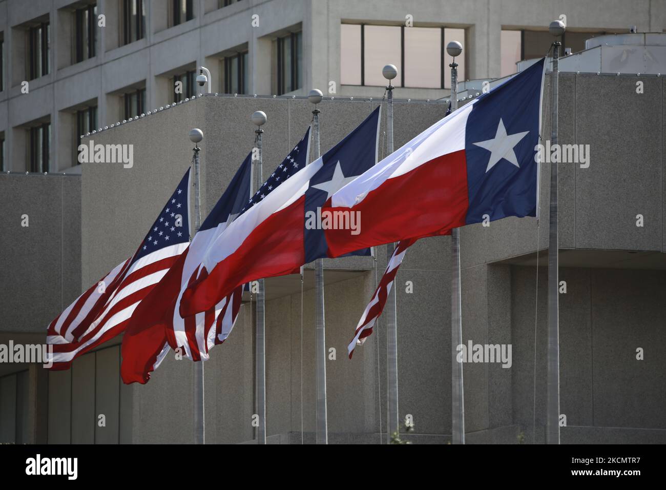 Texan and American flags fly above the demonstration on Saturday, September 18th, 2021 in ...