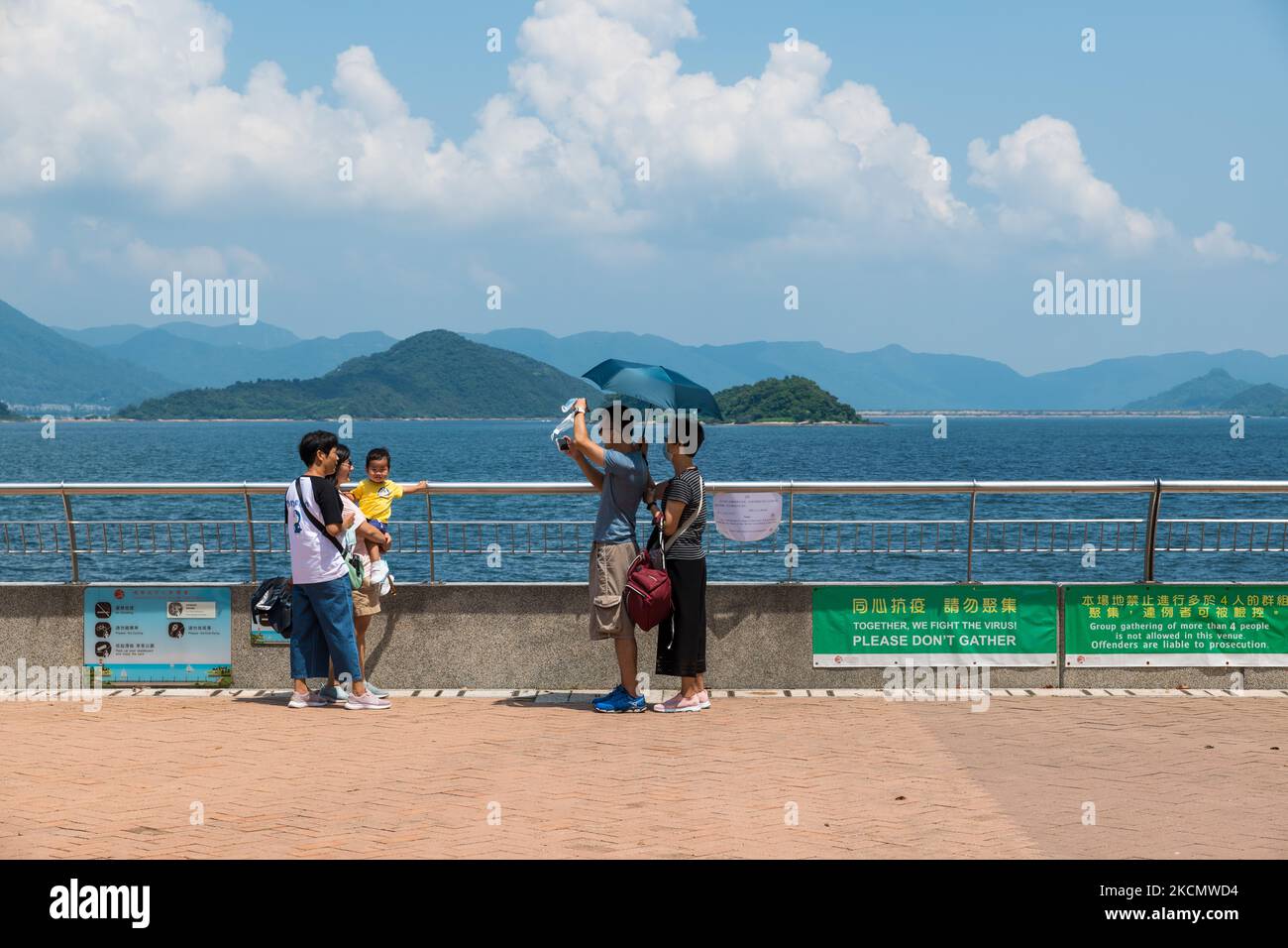 Hong Kong, China, 18 Sep 2021, A family takes a group picture in front ...