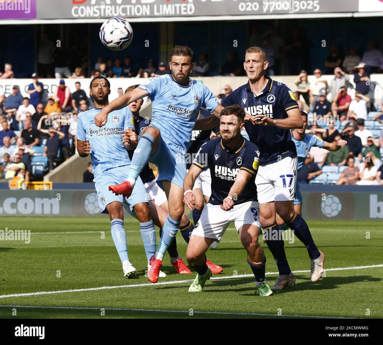 L-R Matt Godden of Coventry City and George Saville of Millwall during ...