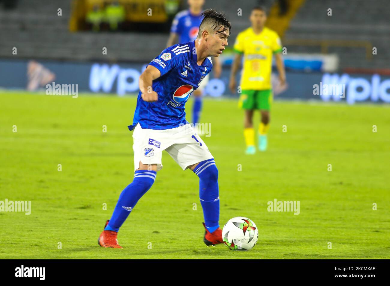 Daniel Ruiz of Millonarios FC controls the ball during the match ...