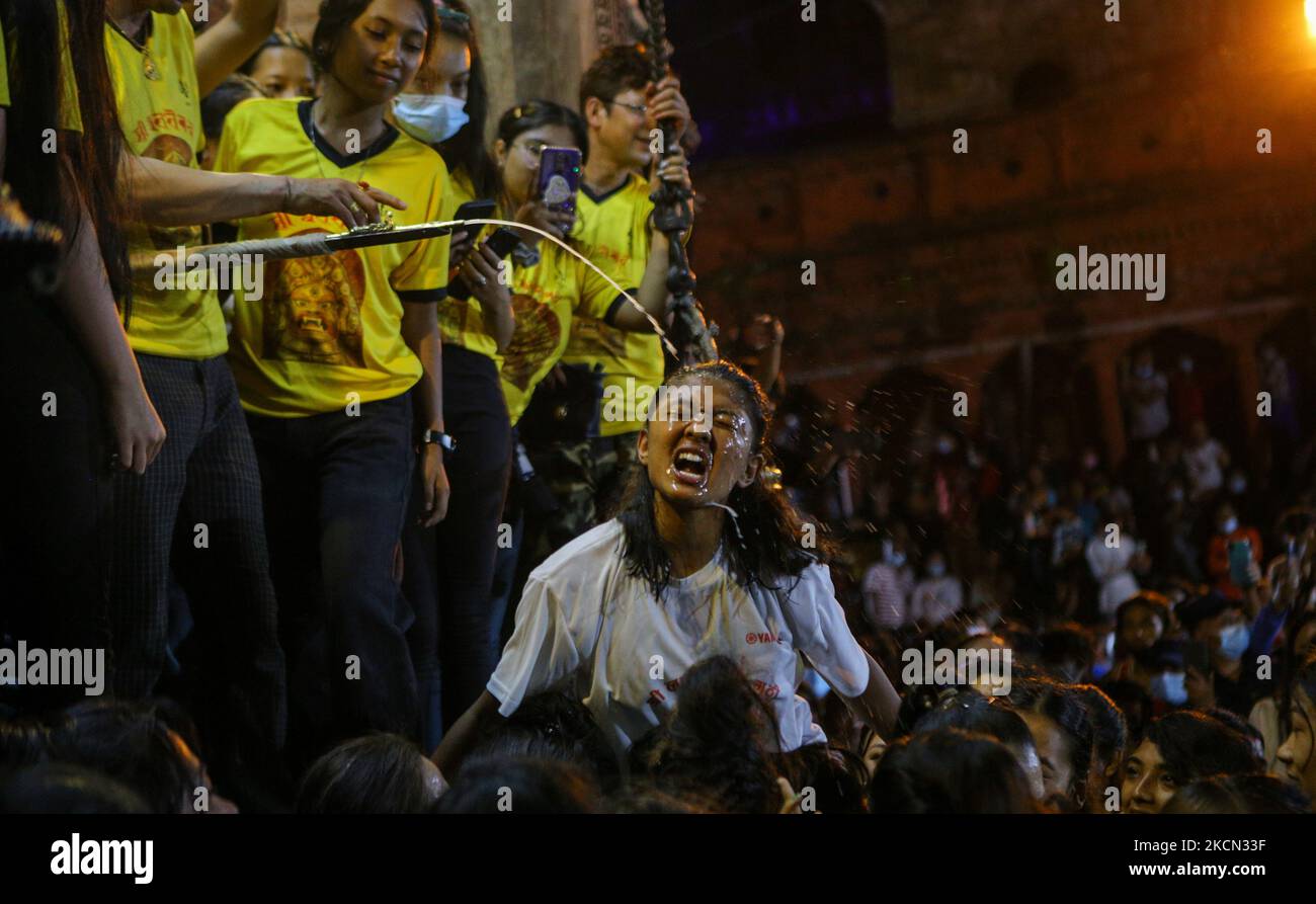 Nepalese women drink homemade alcohol poured from the mouth of Swet ...