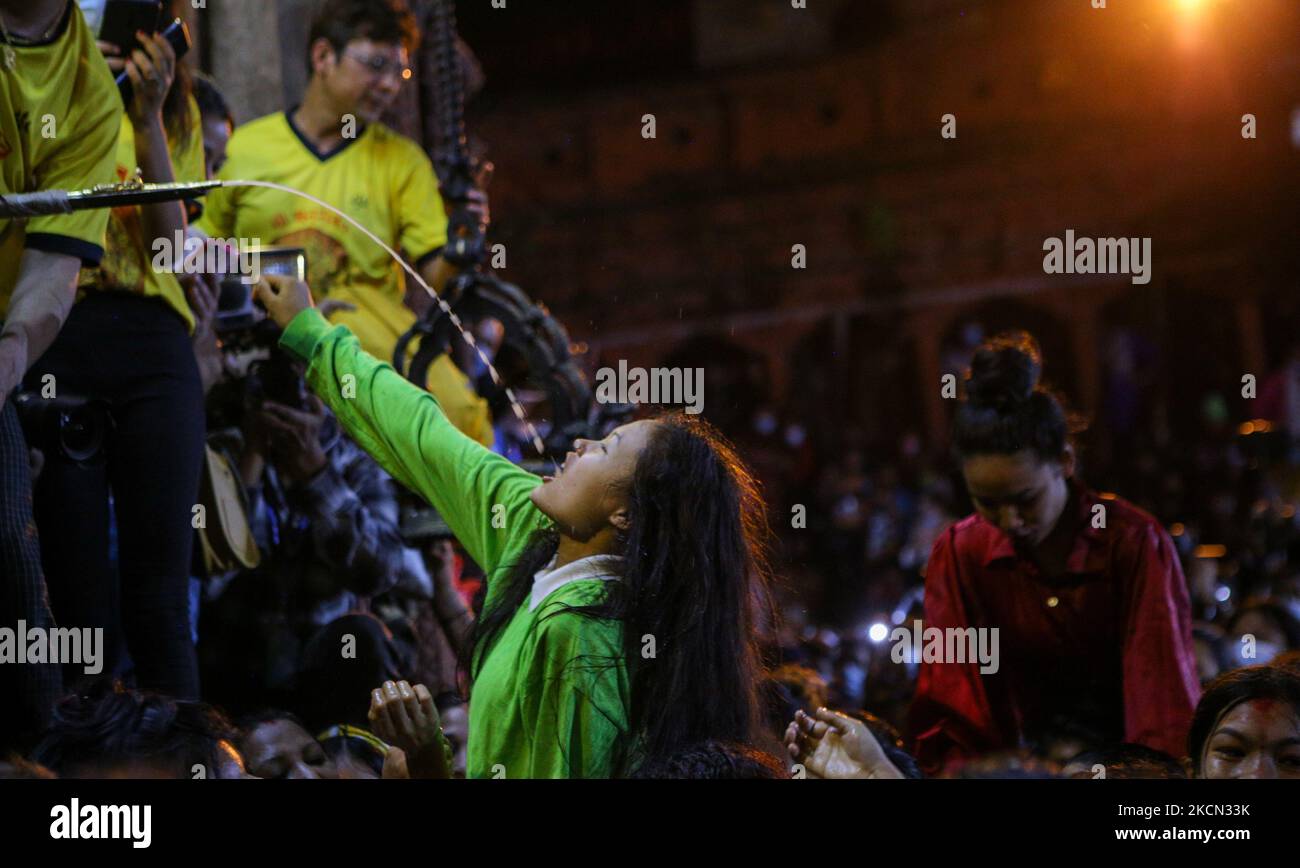 Nepalese women drink homemade alcohol poured from the mouth of Swet ...