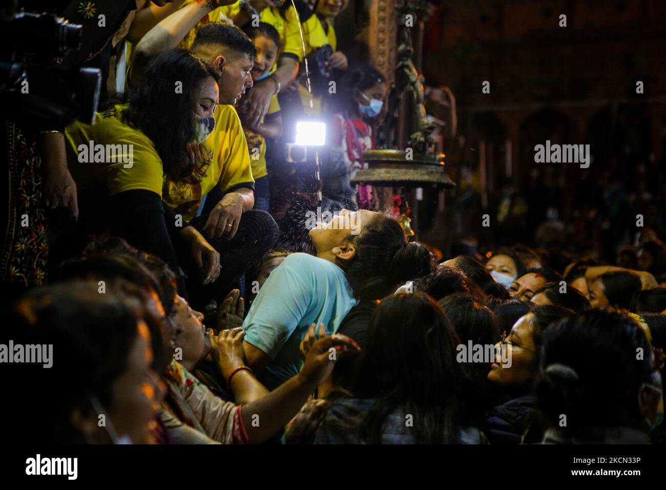 Nepalese women drink homemade alcohol poured from the mouth of Swet ...