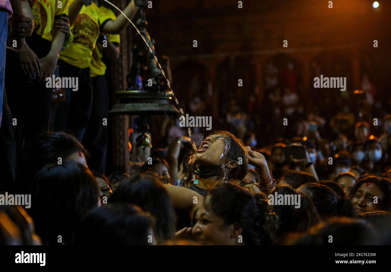 Nepalese women drink homemade alcohol poured from the mouth of Swet ...