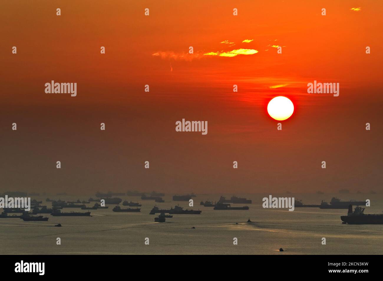 The sun rises as vessels are seen anchored along the southern coast on ...