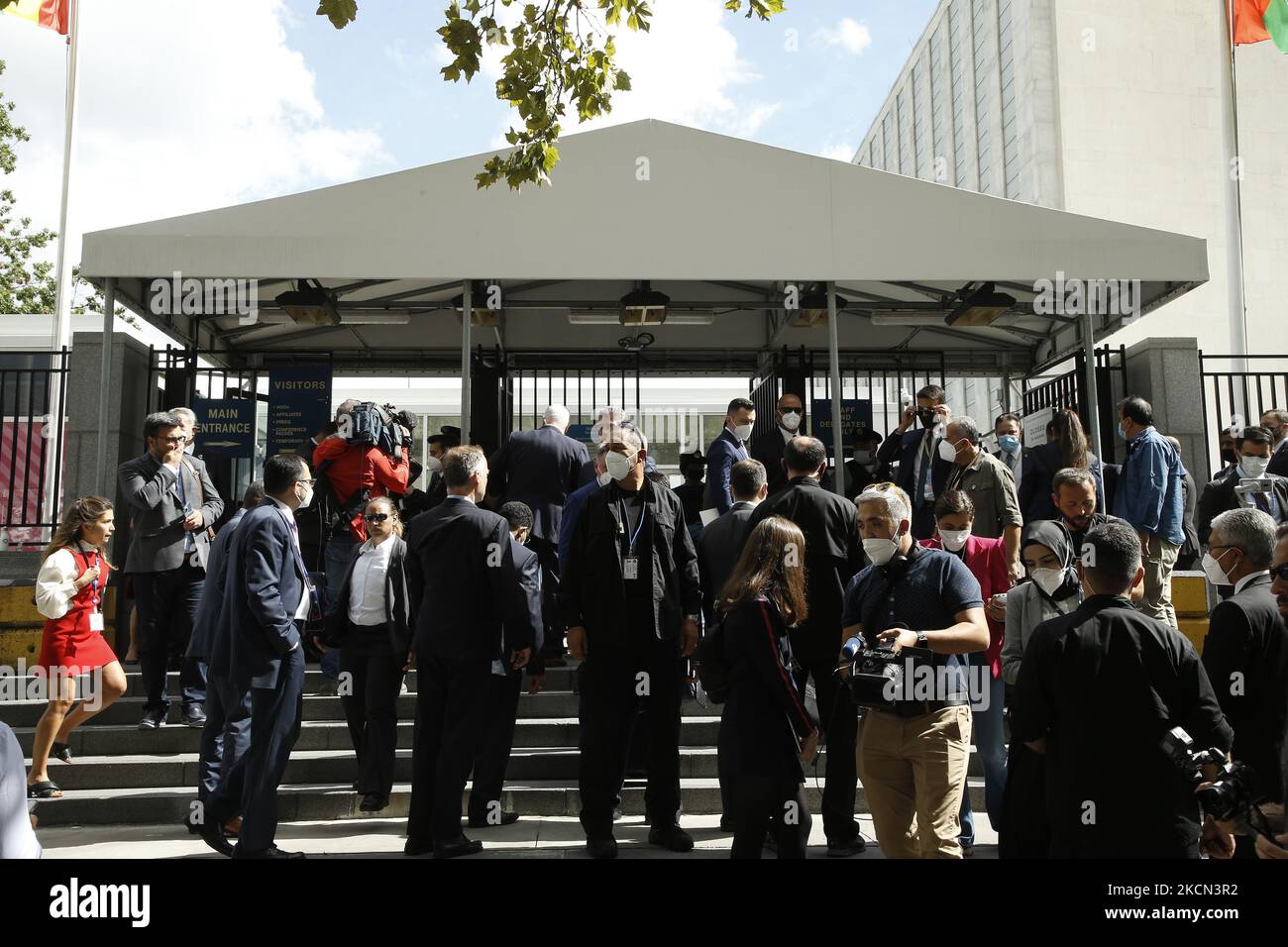 Television media broadcast commentaries as delegates arrive to the ...
