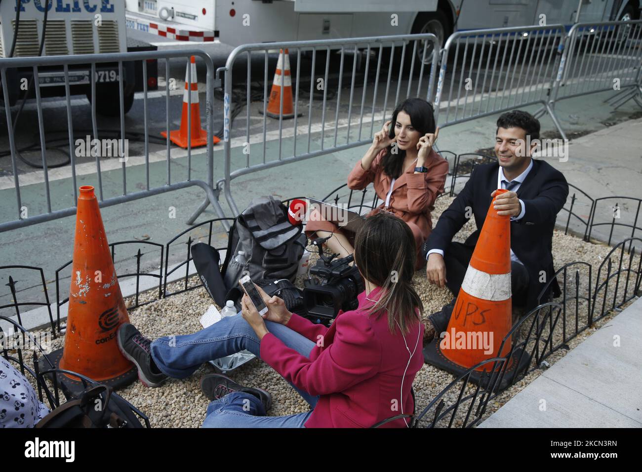 Television media broadcast commentaries as delegates arrive to the ...
