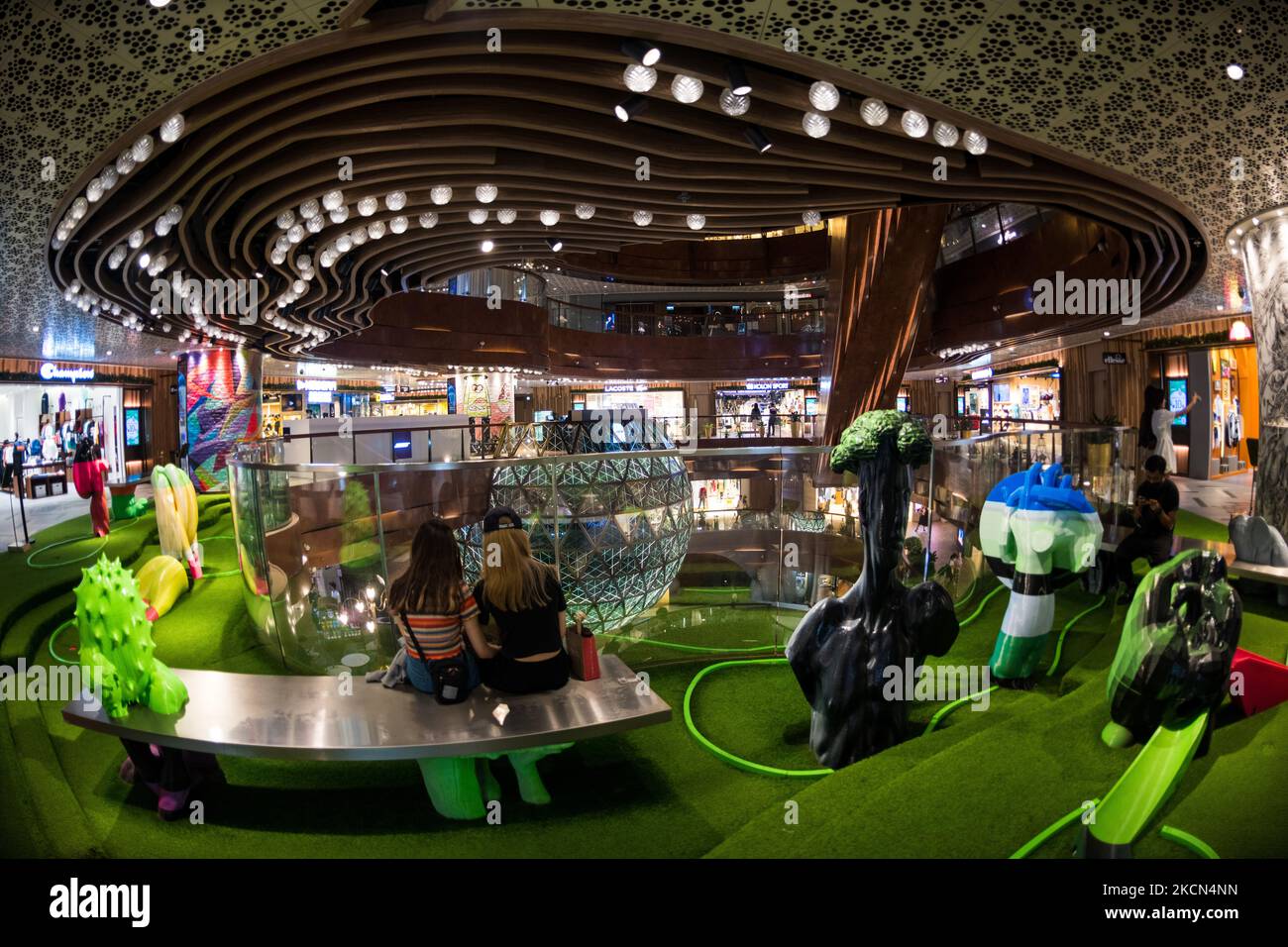 Customers sit down in the midst of a modern art exposition in the K11 ...