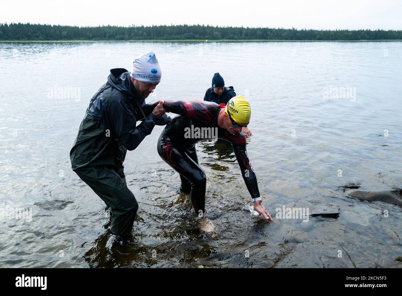 Athletes reaches the swim out, at Swedeman 2021 in Åre, Sweden (Photo ...