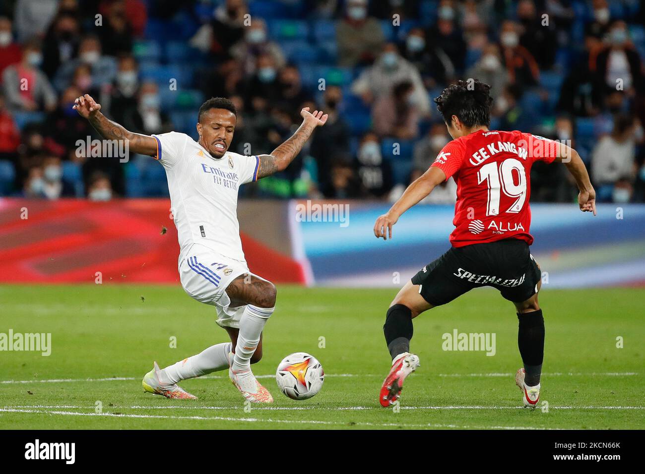 Eder Militao of Real Madrid in action with Kang-in Lee of RCD Mallorca ...