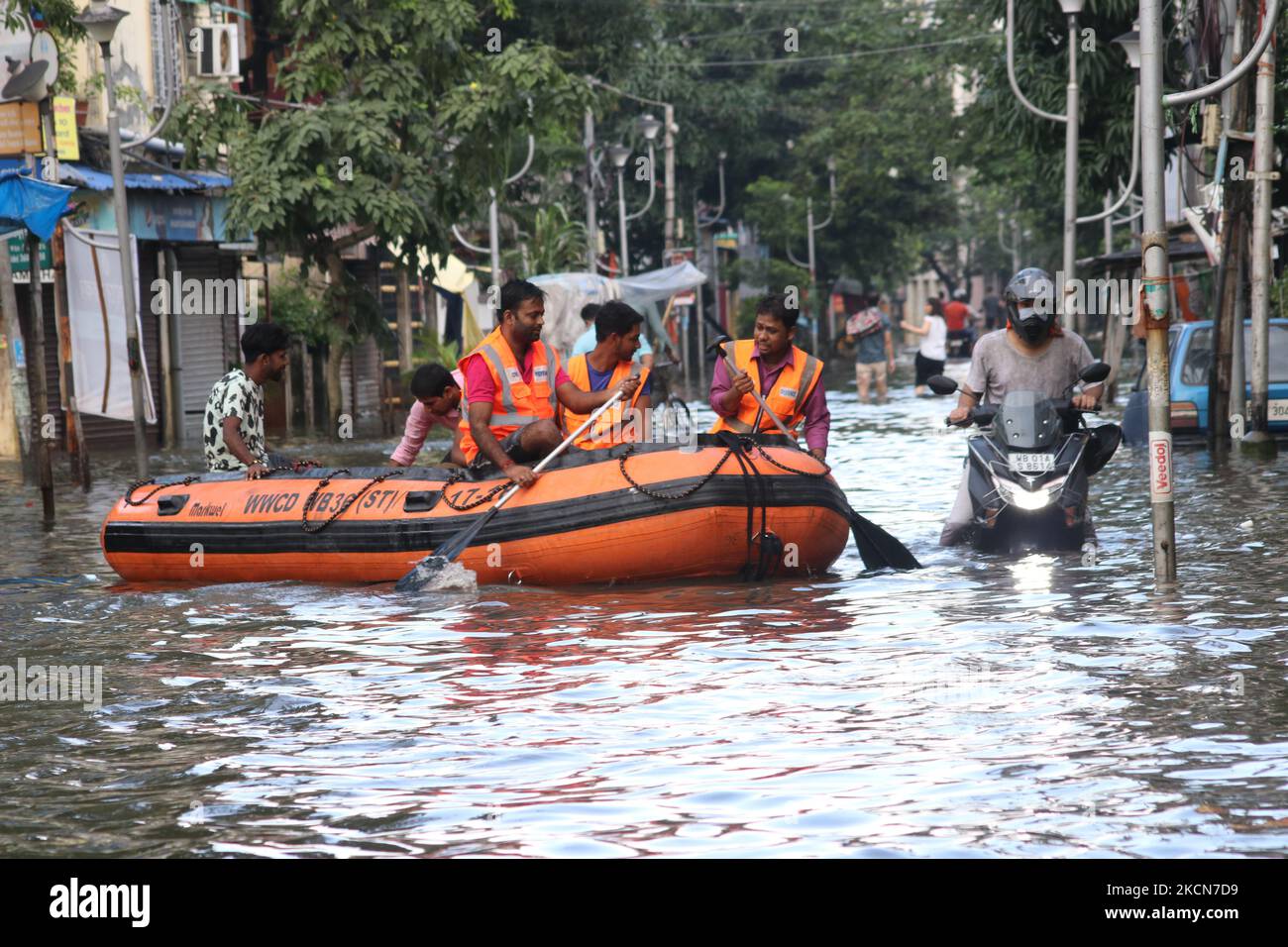 Disaster management team in a boat through the waterlogged area during ...