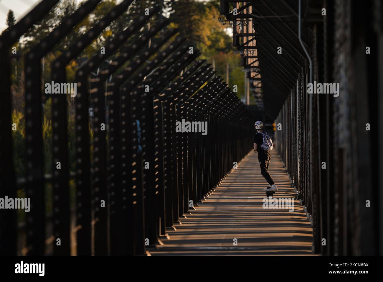 A man on onewheel, a self-balancing single wheel electric board, seen ...