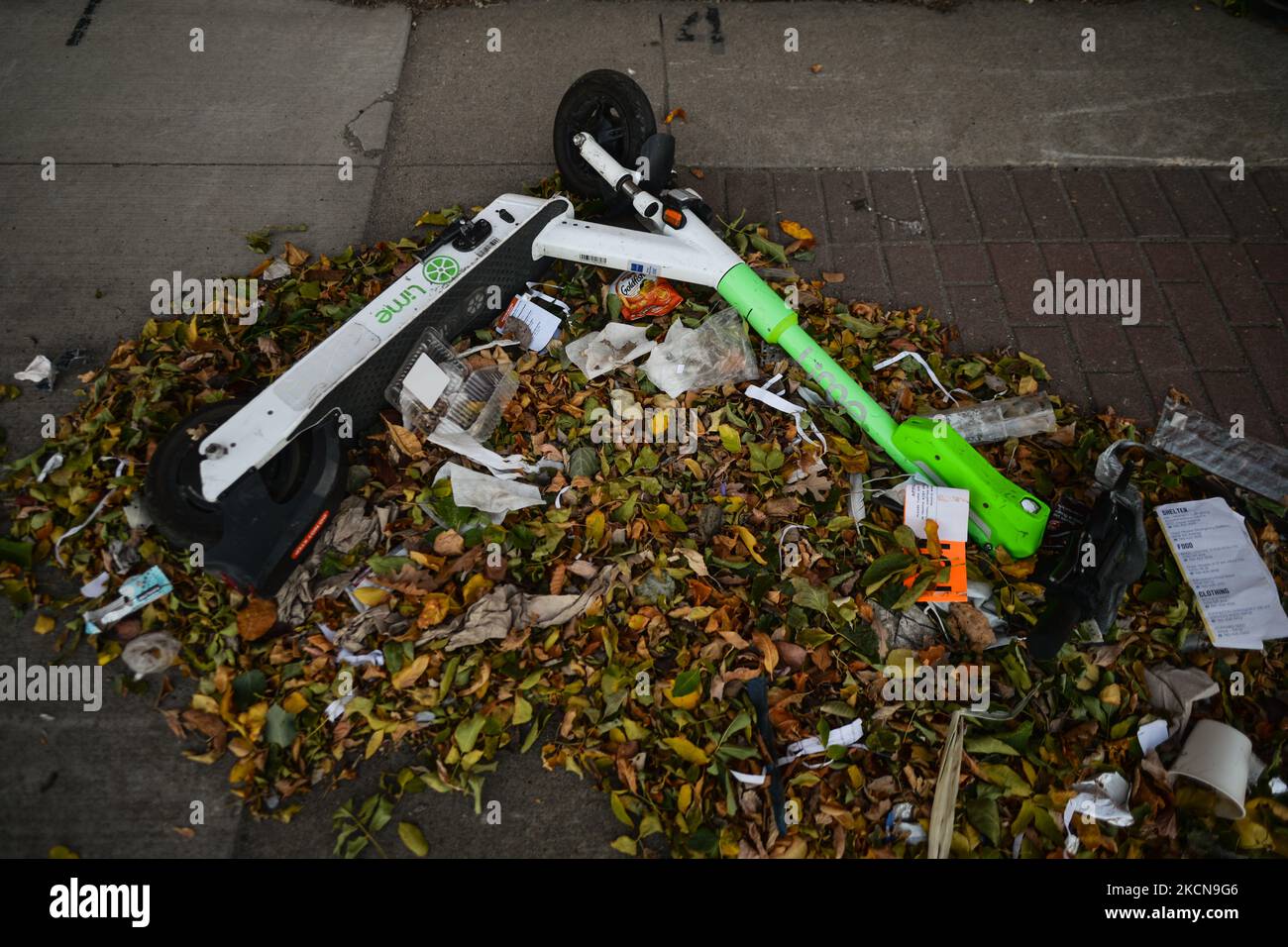 Wrecked electric scooter seen on the sidewalk in downtown Edmonton. On ...